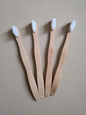 China Wooden Bamboo Toothbrush Hotel Bathroom Amenities With Engraving Custom Logo supplier